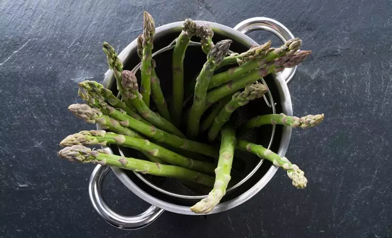 Asparagus can be cooked either lying down in a normal pot or standing up in an asparagus cooker.